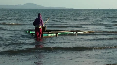 Filipino woman catching Milkfish fry in ... | Stock Video | Pond5