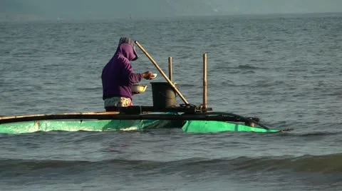 Filipino woman catching Milkfish fry in ... | Stock Video | Pond5