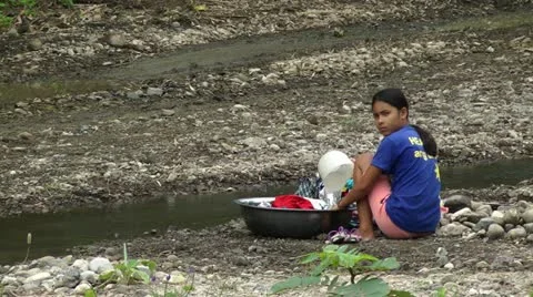Filipino woman hand washing clothes at a... | Stock Video | Pond5