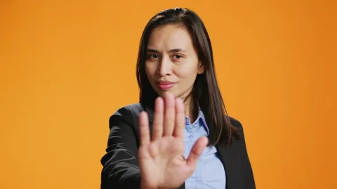Filipino woman showing stop sign with pa... | Stock Video | Pond5