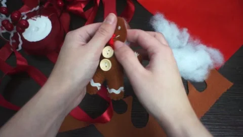 Filling the felt gingerbread man with ho... | Stock Video | Pond5