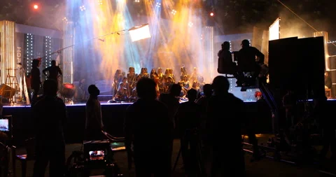 Film Crew silhouettes at stage Night tim... | Stock Video | Pond5