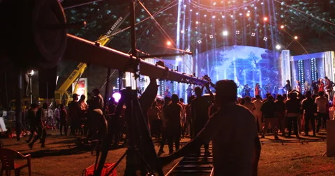 Film Crew silhouettes at stage Night tim... | Stock Video | Pond5