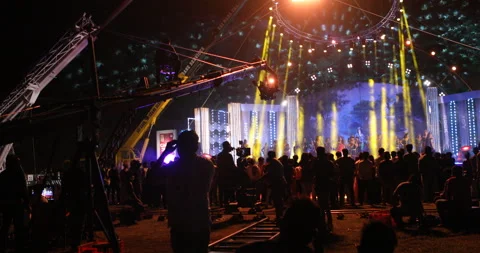 Film Crew silhouettes at stage Night tim... | Stock Video | Pond5