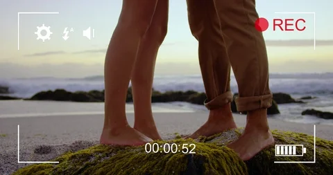 Filming a couple on a beach on a digital... | Stock Video | Pond5