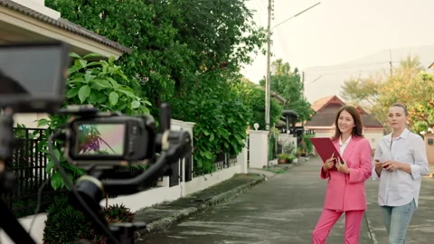 Filming outside with a private house in ... | Stock Video | Pond5