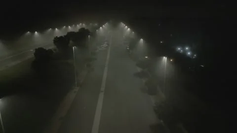 Filming a street into the mist at night ... | Stock Video | Pond5