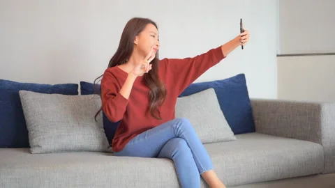 Finding the right selfie pose is hard wo... | Stock Video | Pond5