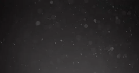 Fine particles flying around against dar... | Stock Video | Pond5