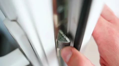 The finger checks the spring mechanism o... | Stock Video | Pond5