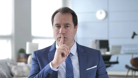 Finger on Lips, Middle Aged Businessman ... | Stock Video | Pond5