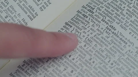 Finger Pointing to Word in Dictionary | Stock Video | Pond5