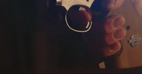 finger pulling trigger of revolver and l... | Stock Video | Pond5