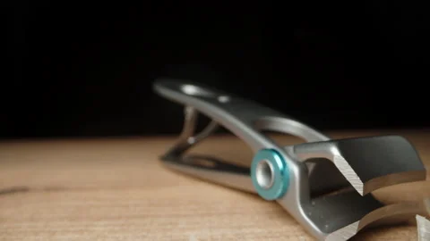 fingernail clipper on a black background... | Stock Video | Pond5