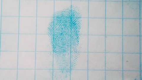 fingerprints on paper under a magnifying... | Stock Video | Pond5