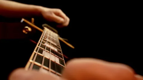 Fingers hitting strings on electric guit... | Stock Video | Pond5
