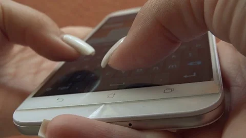 fingers of a woman typing a text message... | Stock Video | Pond5