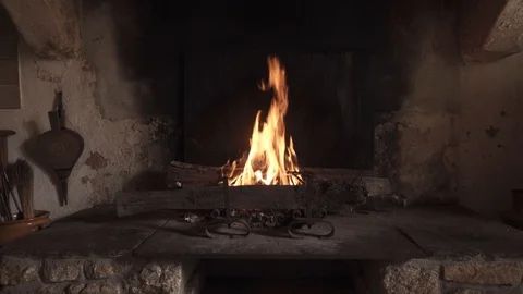 Fire in an ancient fireplace . | Stock Video | Pond5