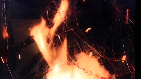 Fire behind a broken window by military ... | Stock Video | Pond5