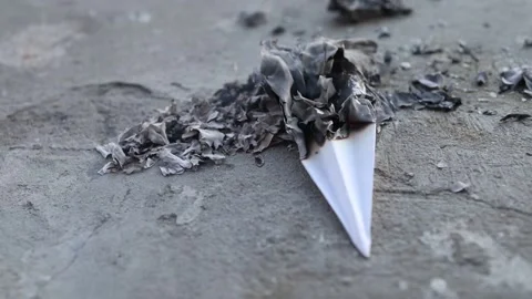 A fire is burning on a paper plane. pape... | Stock Video | Pond5