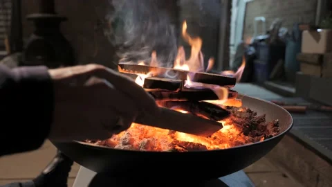 Fire burning in a raised fire pit on a p... | Stock Video | Pond5