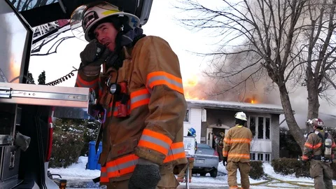 Fire Chief speaking into radio with stru... | Stock Video | Pond5