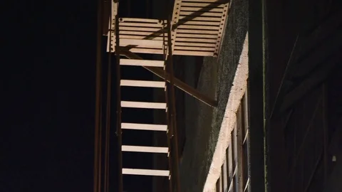 Fire escape in the city at night | Stock Video | Pond5