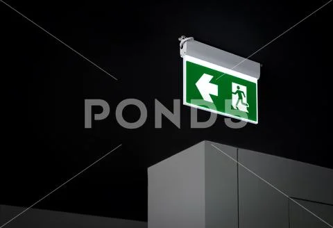 Fire exit sign. Green electric emergency evacuation escape sign with ...
