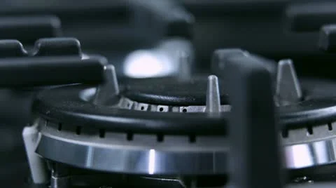 Fire exploding after igniting cooktop on... | Stock Video | Pond5