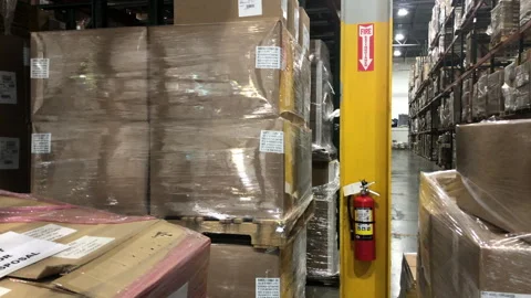 Fire Extinguisher on Yellow Pole in Ware... | Stock Video | Pond5