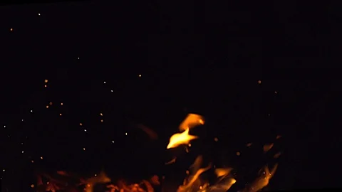 Fire flames and a lot of bright sparks a... | Stock Video | Pond5