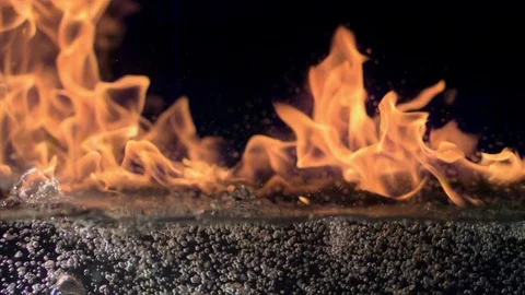 Fire flaming on bubble water in slow mot... | Stock Video | Pond5