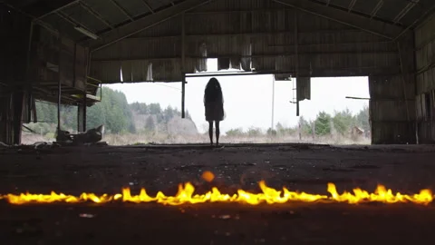 Fire in Front of a Creepy Figure | Stock Video | Pond5