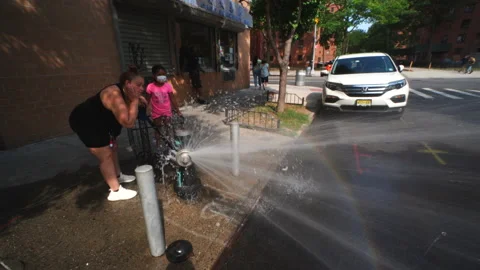 The Fire hydrant gushes water on the str... | Stock Video | Pond5