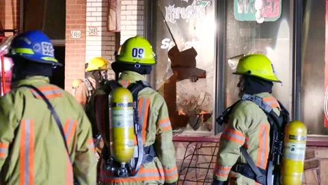 Fire intervention with broken windows at... | Stock Video | Pond5