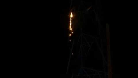 Fire on large metal structure pylon towe... | Stock Video | Pond5