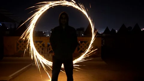 fire ring behind man light painting with... | Stock Video | Pond5