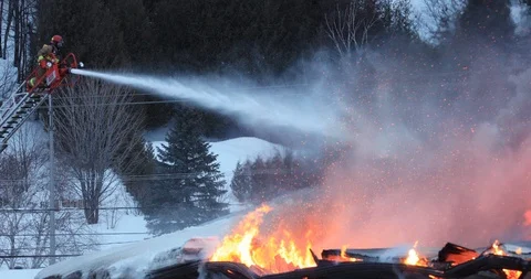 Firefighter fighting a fully involved fi... | Stock Video | Pond5
