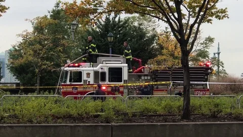 Firefighter on fire engine inside barric... | Stock Video | Pond5