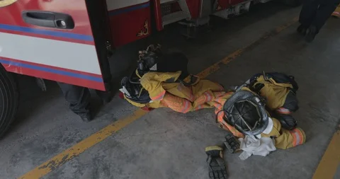 Firefighter gear on fire station floor | Stock Video | Pond5