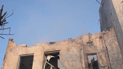 firefighter hero, dousing fire, ruined b... | Stock Video | Pond5