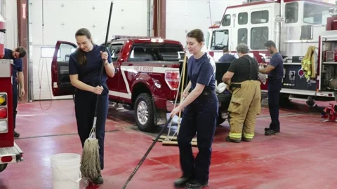 Firefighter mopping fire station floor | Stock Video | Pond5