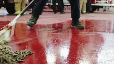 Firefighter mopping fire station floor | Stock Video | Pond5
