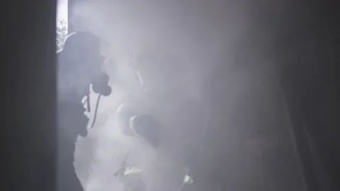 Firefighter Pointing Through Smoke | Stock Video | Pond5