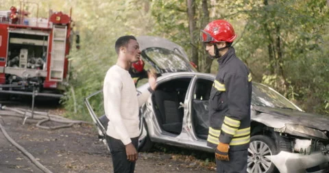 Firefighter questioning black victim of ... | Stock Video | Pond5