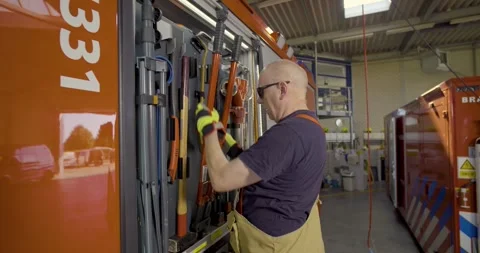 Firefighter retrieving bolt cutters from... | Stock Video | Pond5