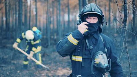 Firefighter is talking over the radio wh... | Stock Video | Pond5