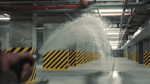 A firefighter is testing the fire safety... | Stock Video | Pond5