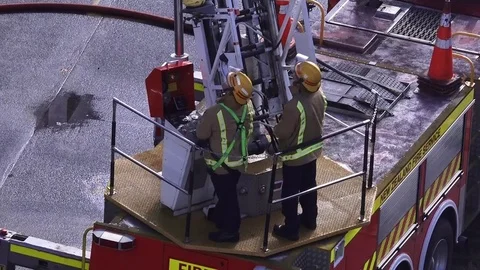 Firefighters exercise maneuvering fire e... | Stock Video | Pond5