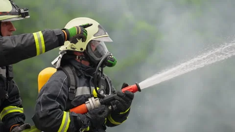 Firefighters fight the fire flame to con... | Stock Video | Pond5